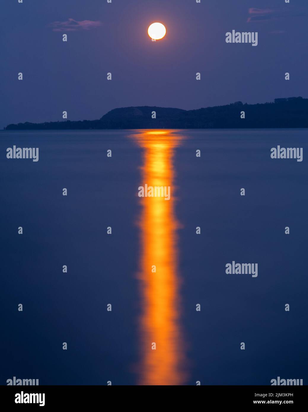 A vertical shot of lunar path on the sea Stock Photo - Alamy