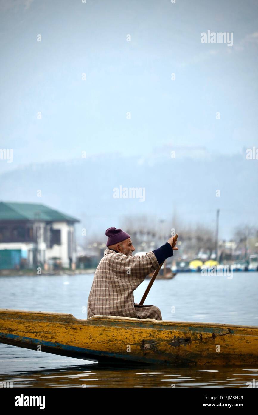 A portrait of a Kashmiri Shikara boat sailor Indian man on Dal Lake ...