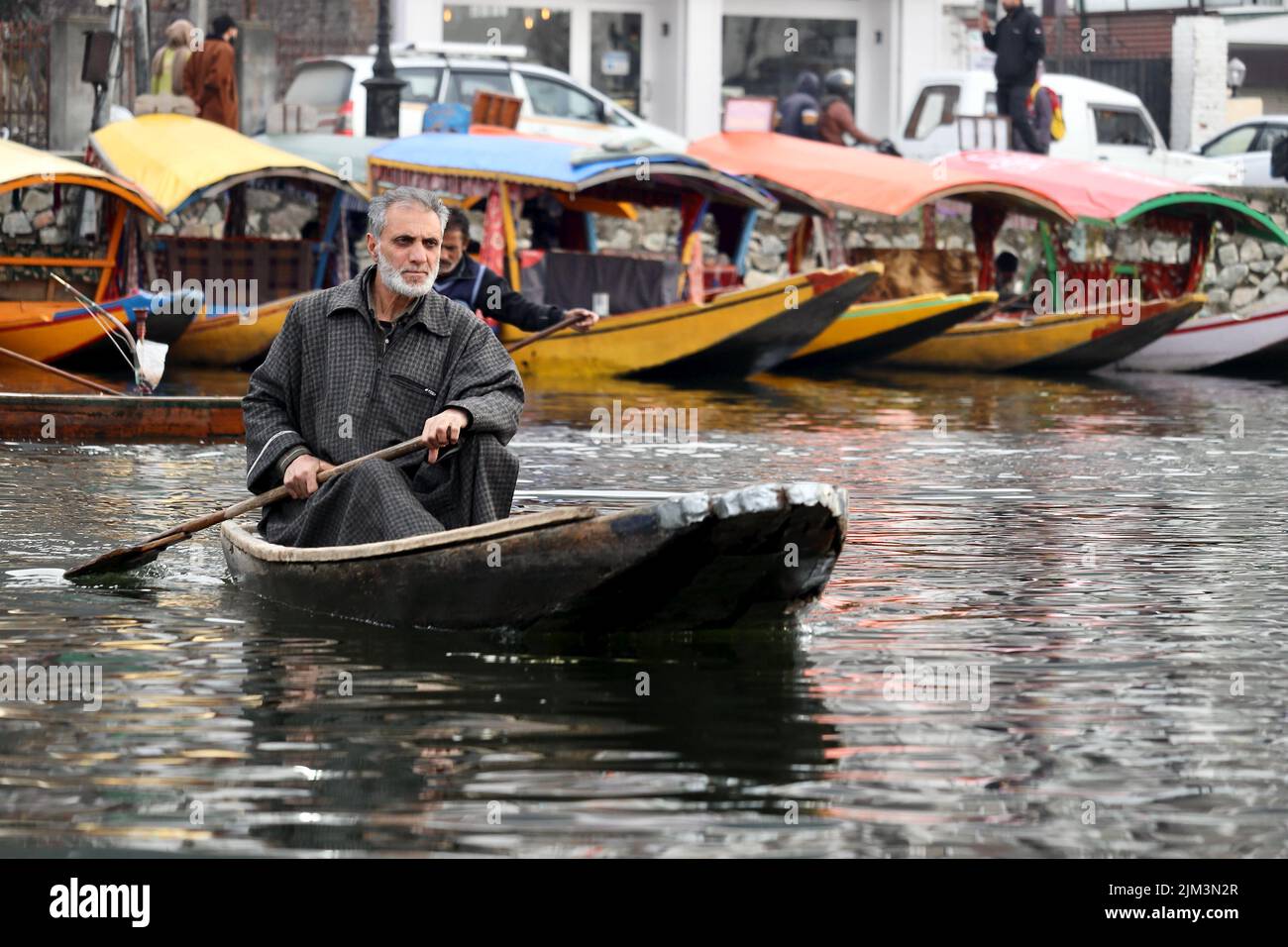 Indian man boatman rowing boat hi-res stock photography and images - Alamy