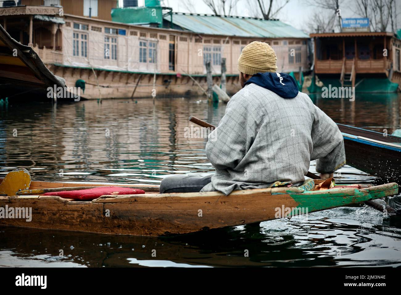 A portrait of a Kashmiri Shikara boat sailor Indian man on Dal Lake ...