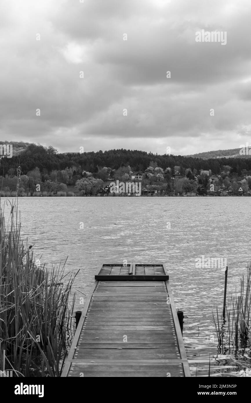 Landscape with a pontoon on the shore of the lake, old, clouds Stock ...