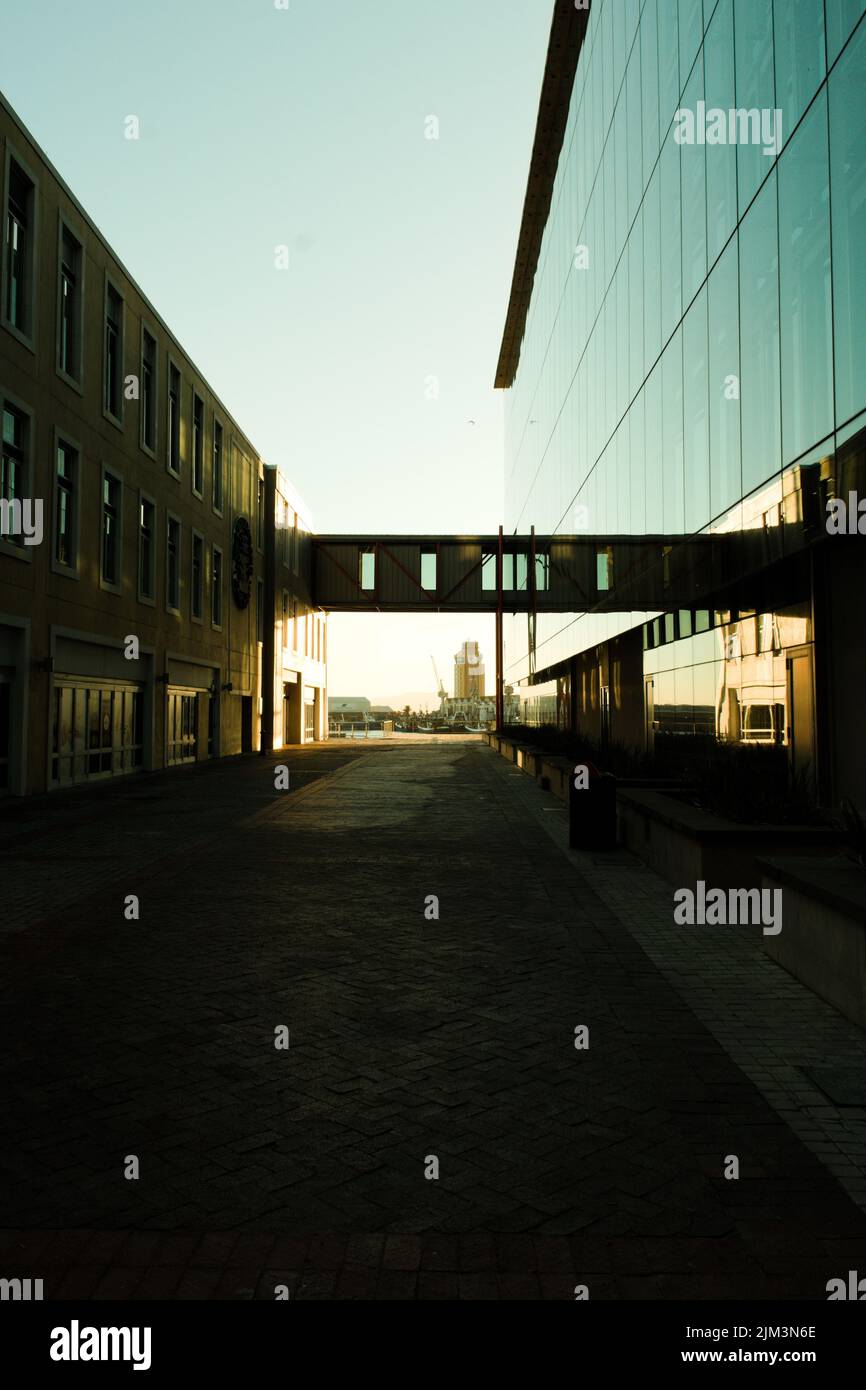 a vertical shot of urban building with bridge between houses Stock ...
