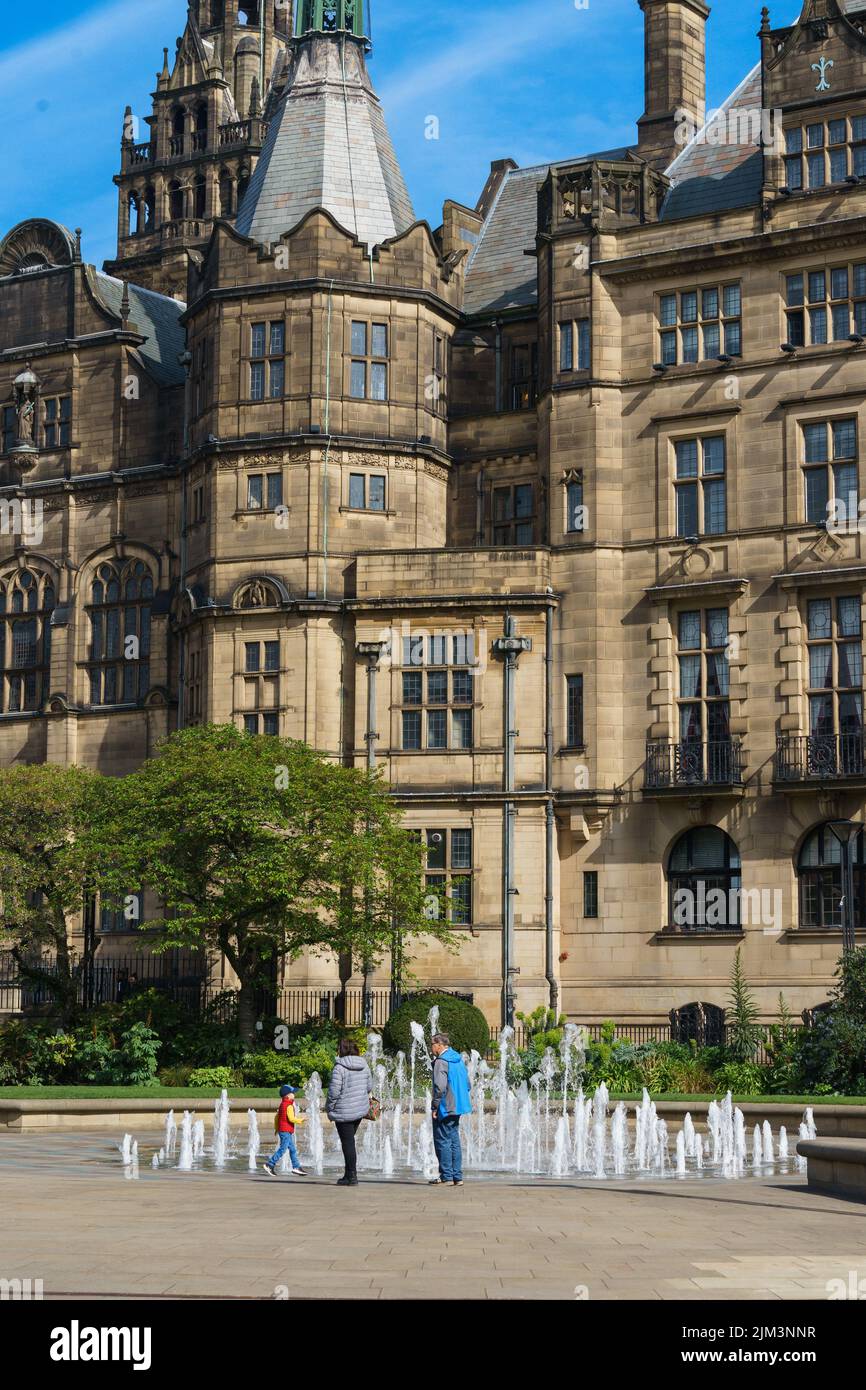 A vertical shot of the historic Peace Gardens and Town Hall in ...
