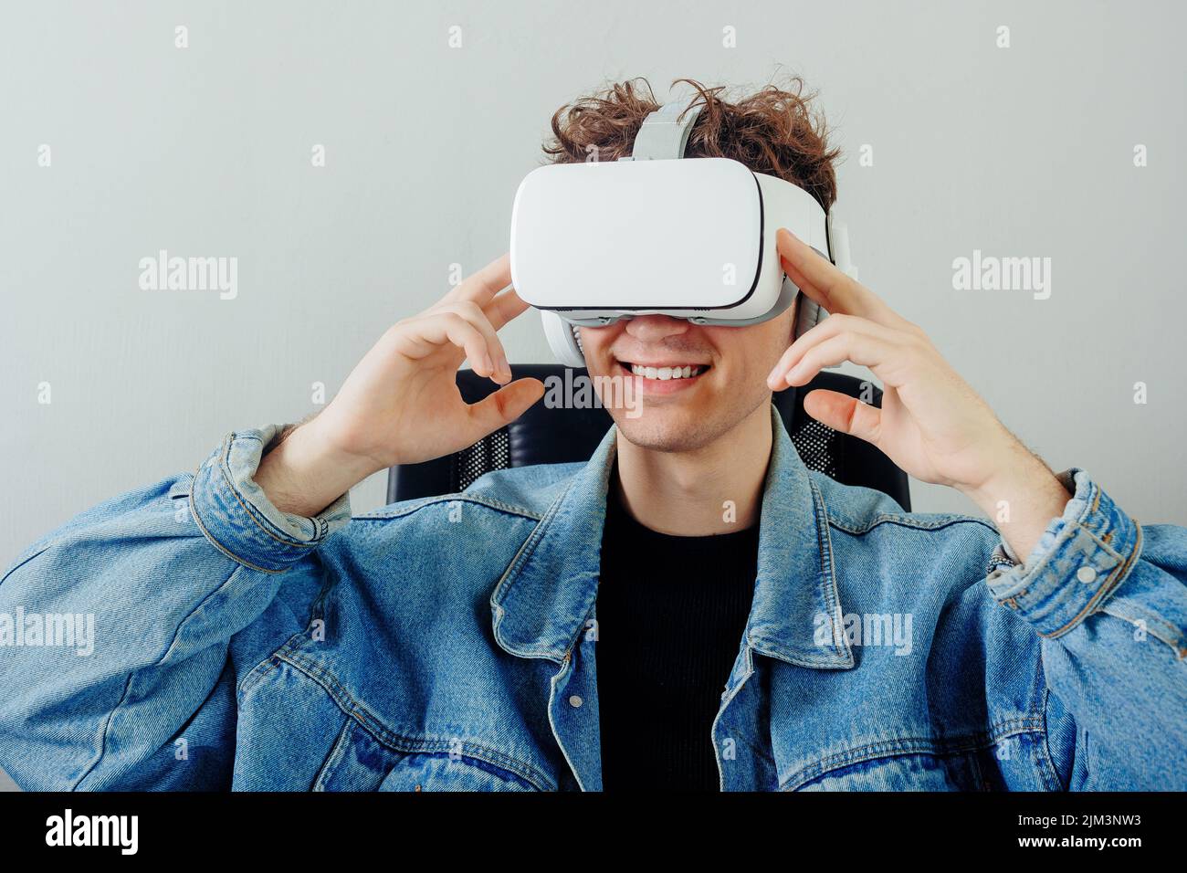Happy male model using virtual hi-res stock photography and images - Alamy