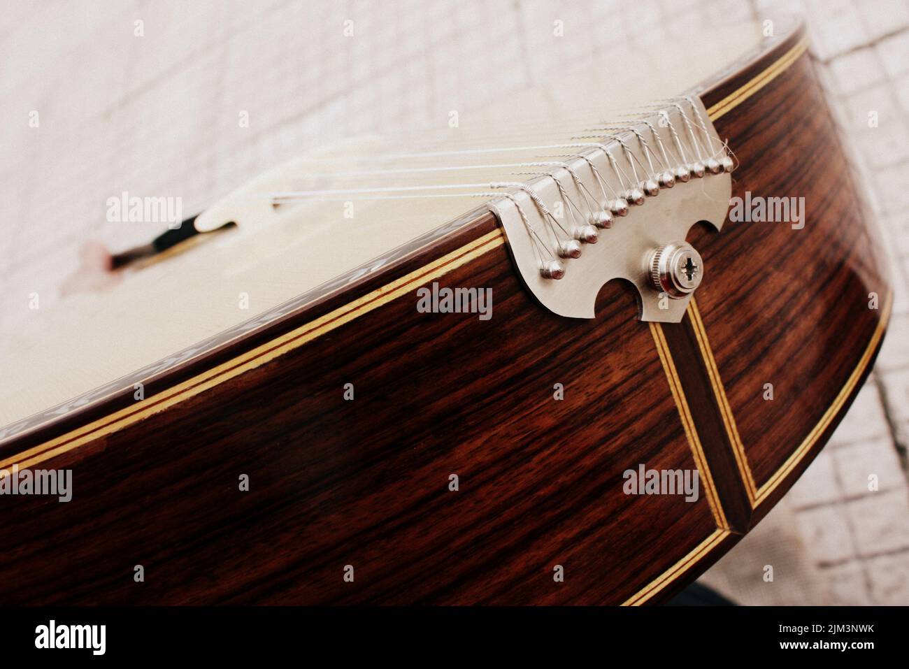 A view a beautiful mandolin taken from the lower part on a blurred ...