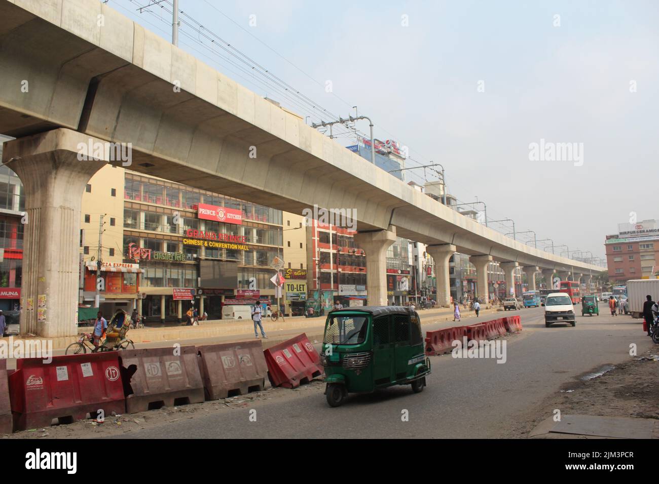 The cycle rickshaws and cars on the street in Mirpur, Dhaka, Bangladesh Stock Photo - Alamy