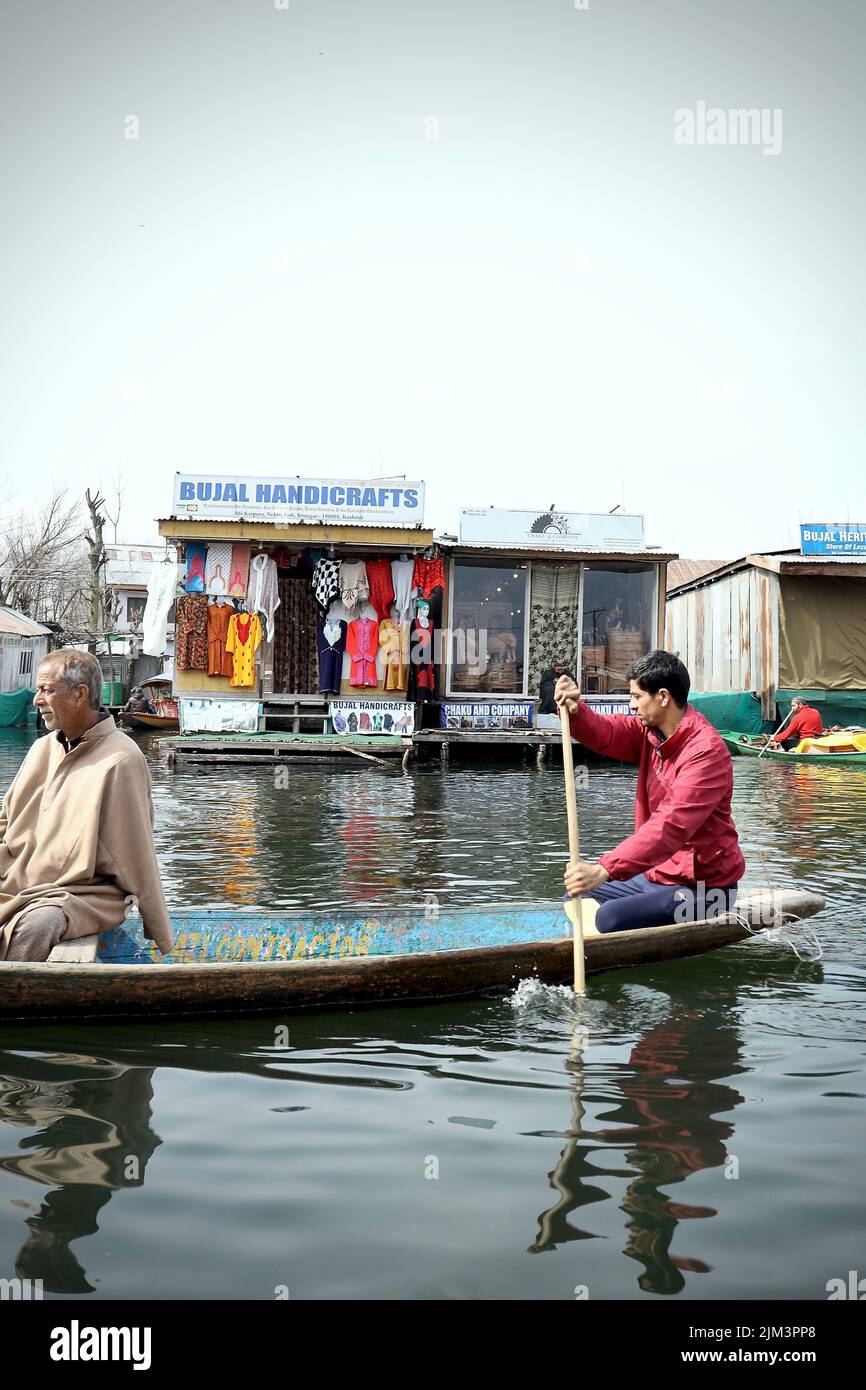 A portrait of a Kashmiri Shikara boat sailor Indian man on Dal Lake ...