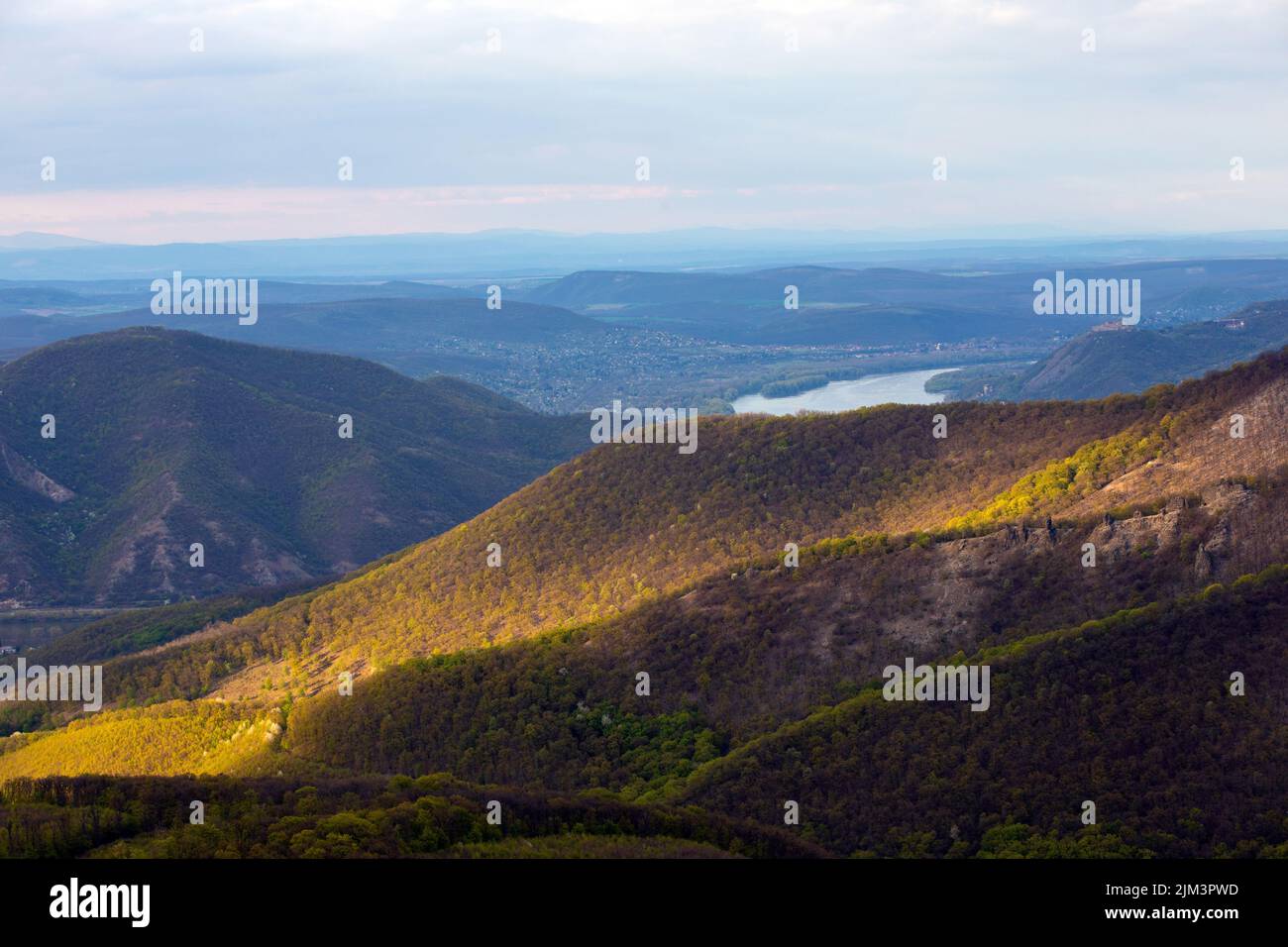 a patch of light over the hills, clouds, sunlight Stock Photo - Alamy