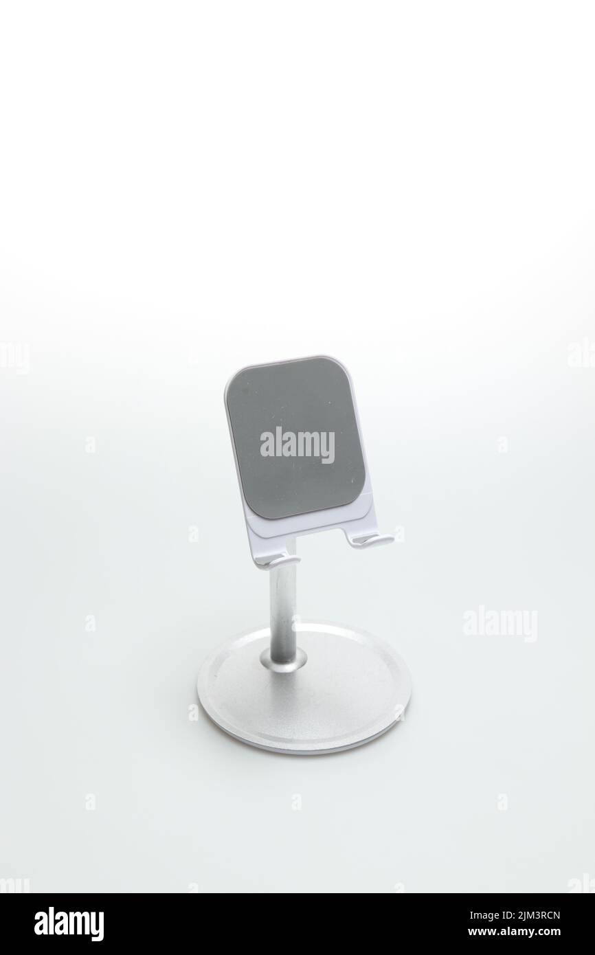 Smartphone stands on a white isolated background. Copy space Stock ...