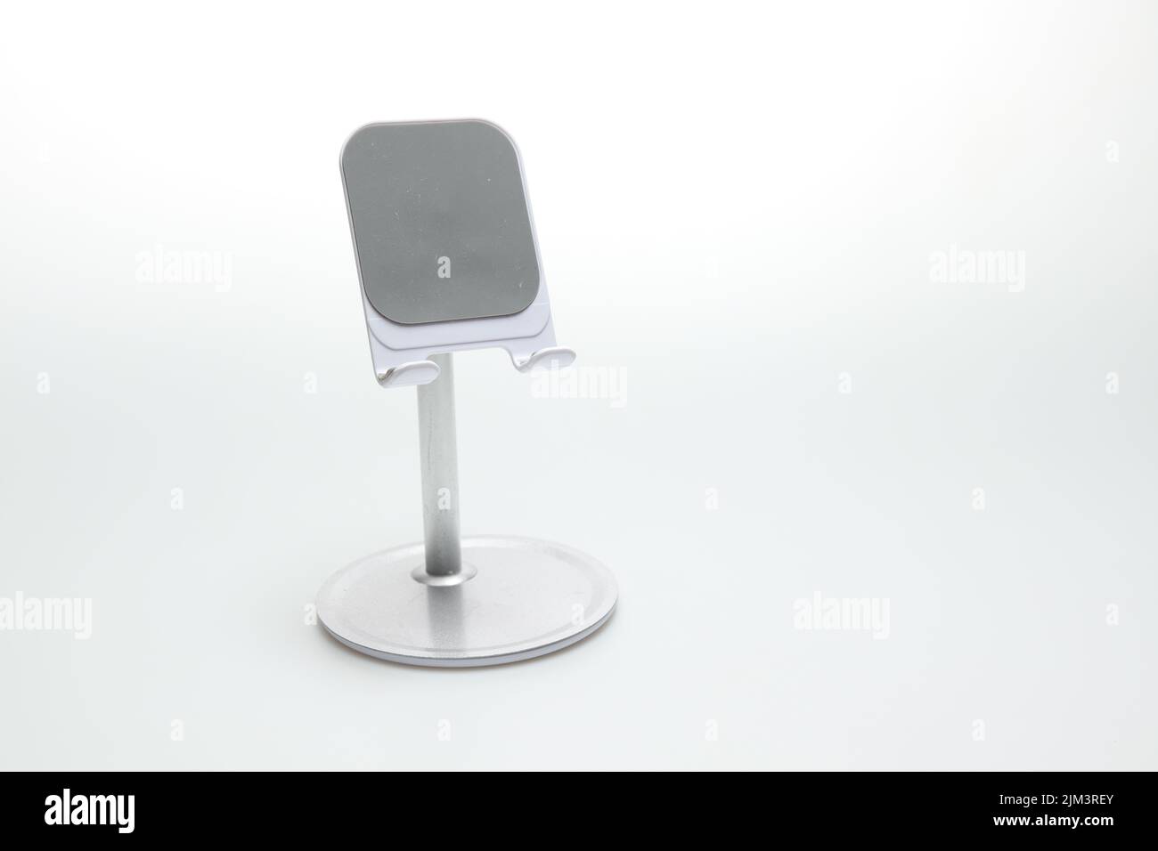 Smartphone stands on a white isolated background. Copy space Stock ...