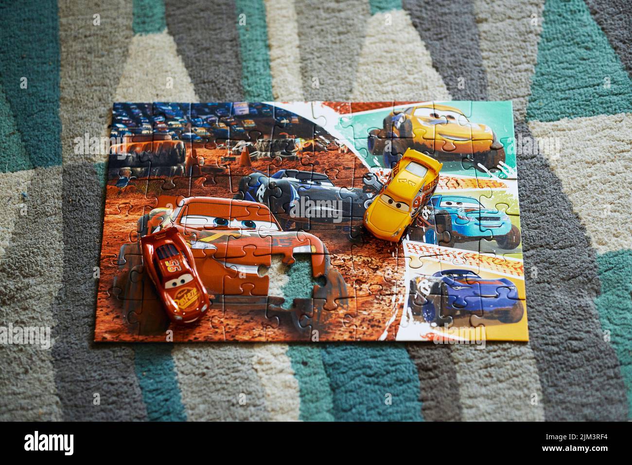 The Mattel Cruz Ramirez and Lightning McQueen on a Trefl Disney Pixar ...