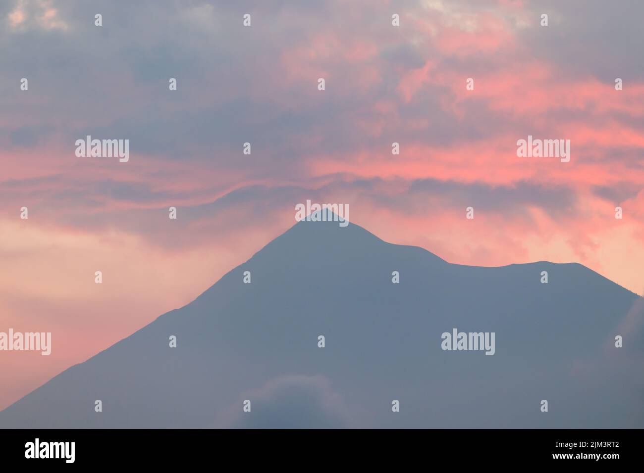 Beautiful sunset clouds above silent volcano de fuego seen from a ...