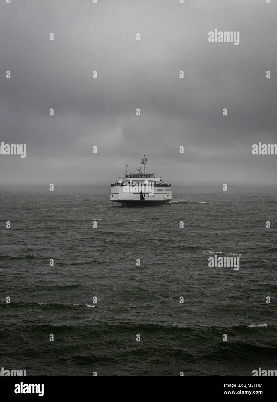 A ferry boat sailing in the ocean between Marthas Vineyard and Cape Cod ...