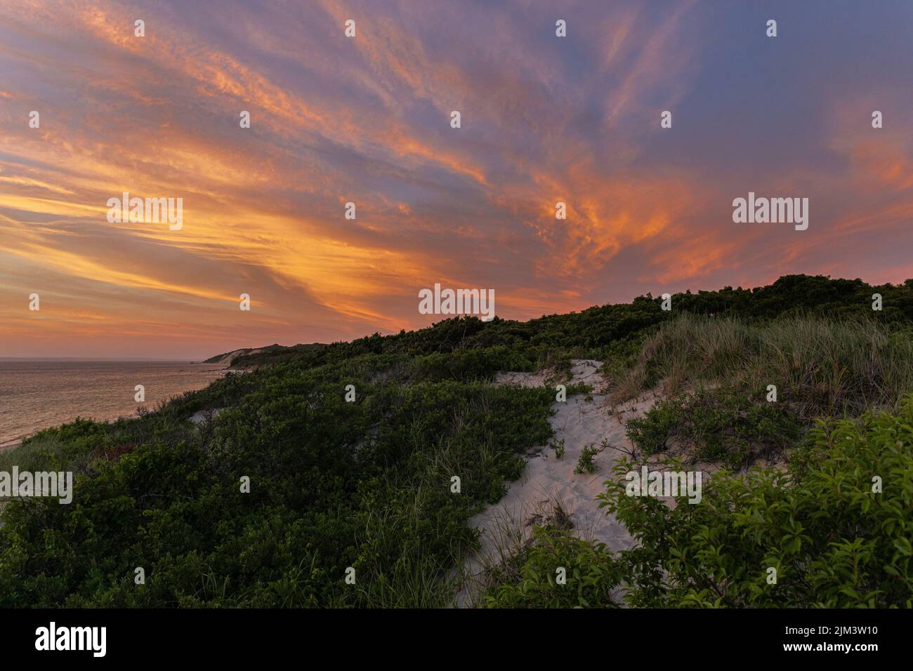 A scenic sunset at the beach on Martha's Vineyard, Massachusetts, the ...