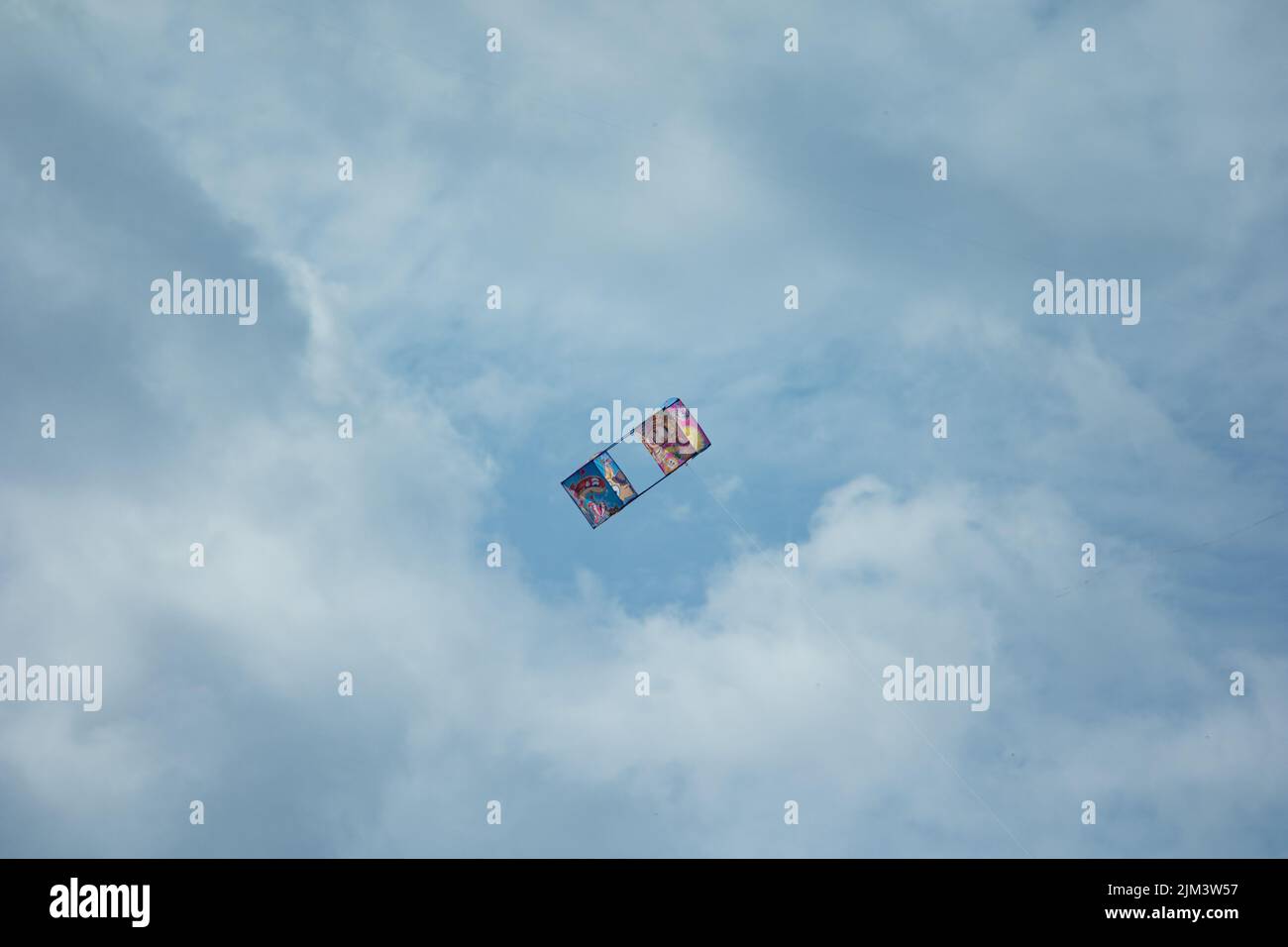 A box kite flies high above the savannah during the easter holiday ...