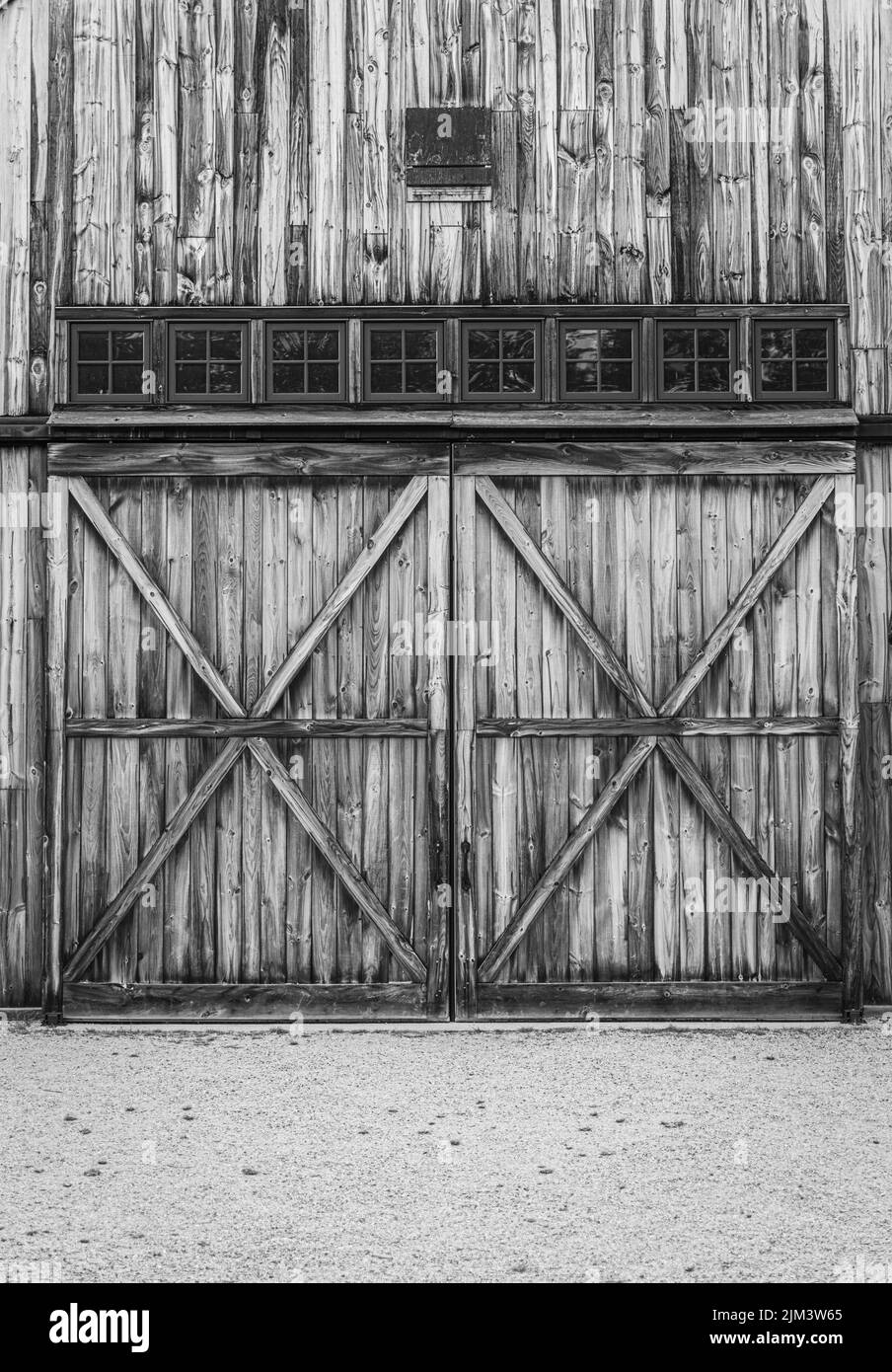 A grayscale shot of the facade of the farm barn in New England Region ...