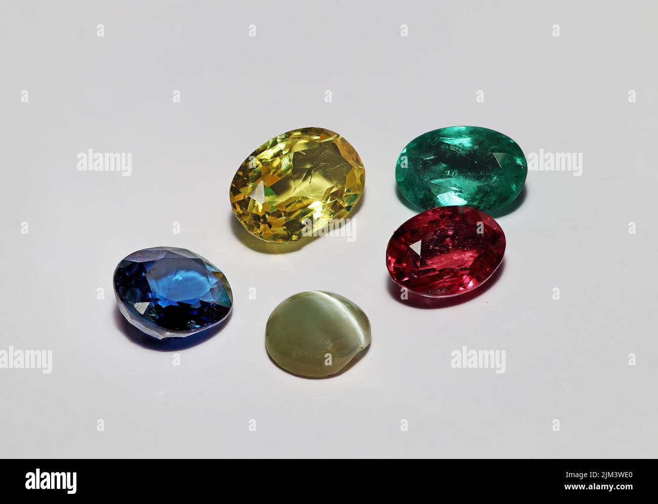 A blue sapphire, yellow sapphire, green emerald, red ruby and khaki cat ...