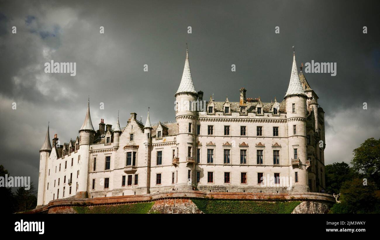 A mesmerizing scene of the Dunrobin Castle & Gardens in Scotland with ...