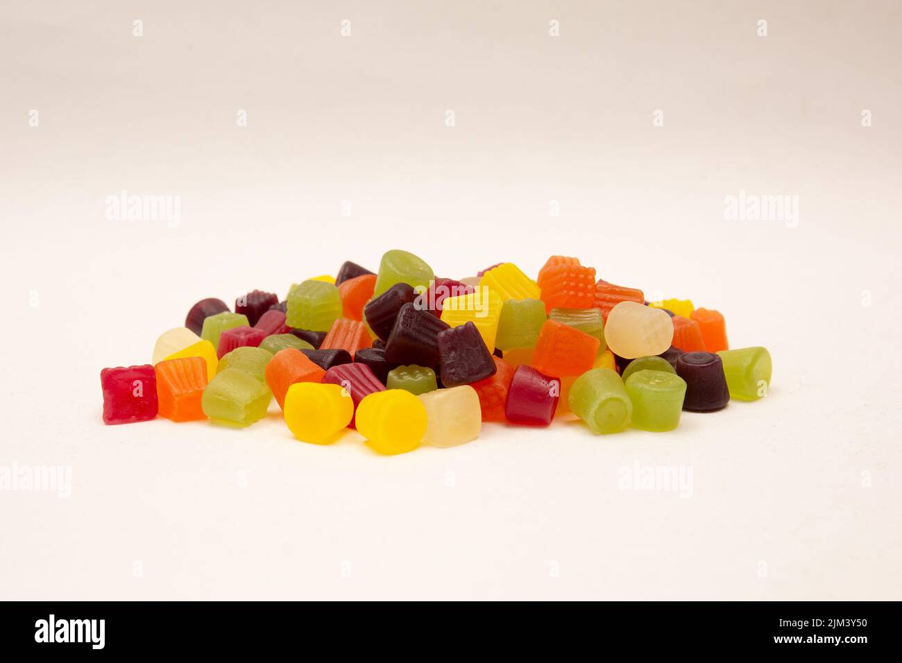 Midget gem gumdrops colorful candy in pile isolated on white background ...
