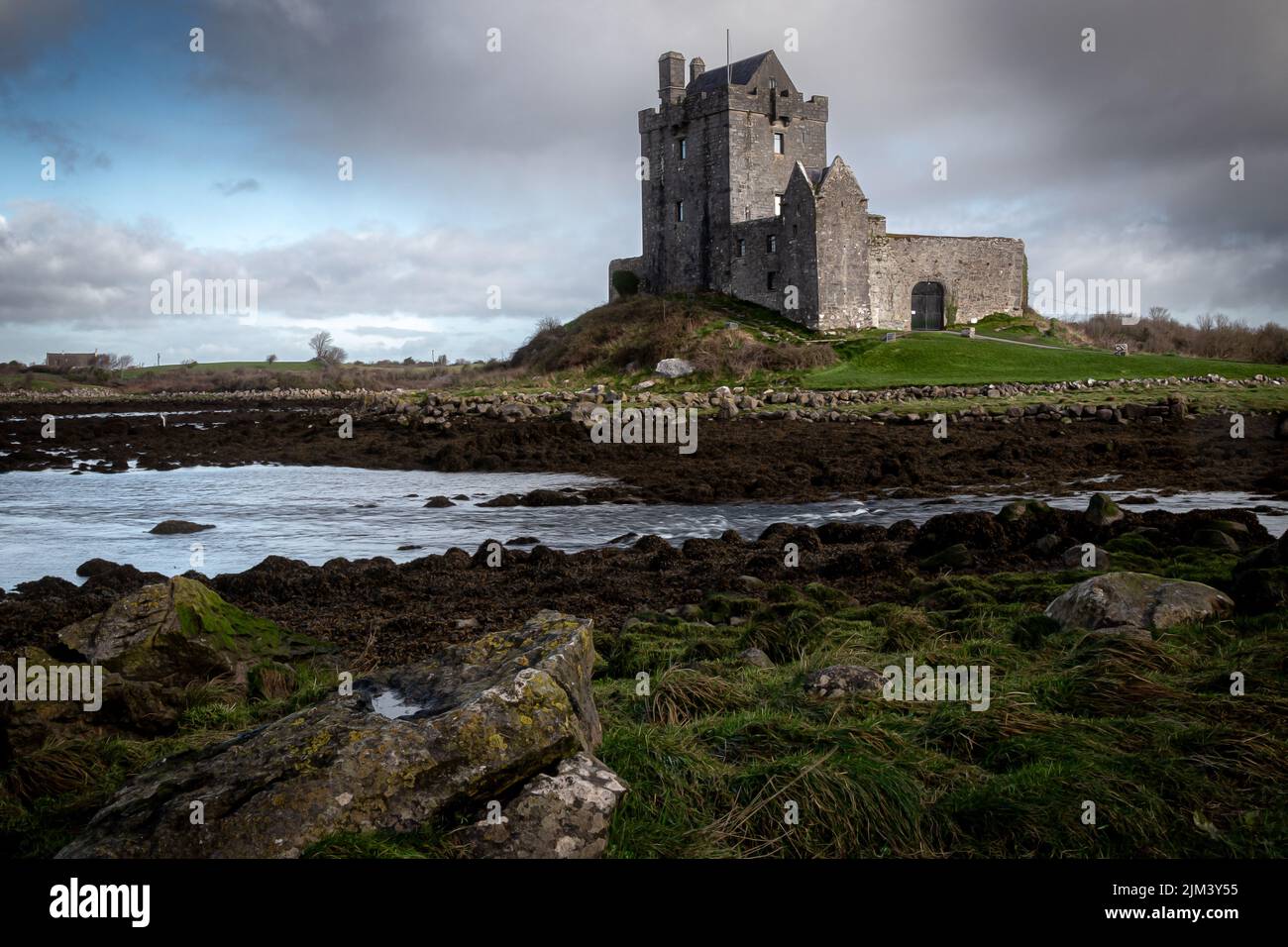A breathtaking view of the Dunguaire Castle in Kinvara, Ireland on dark ...