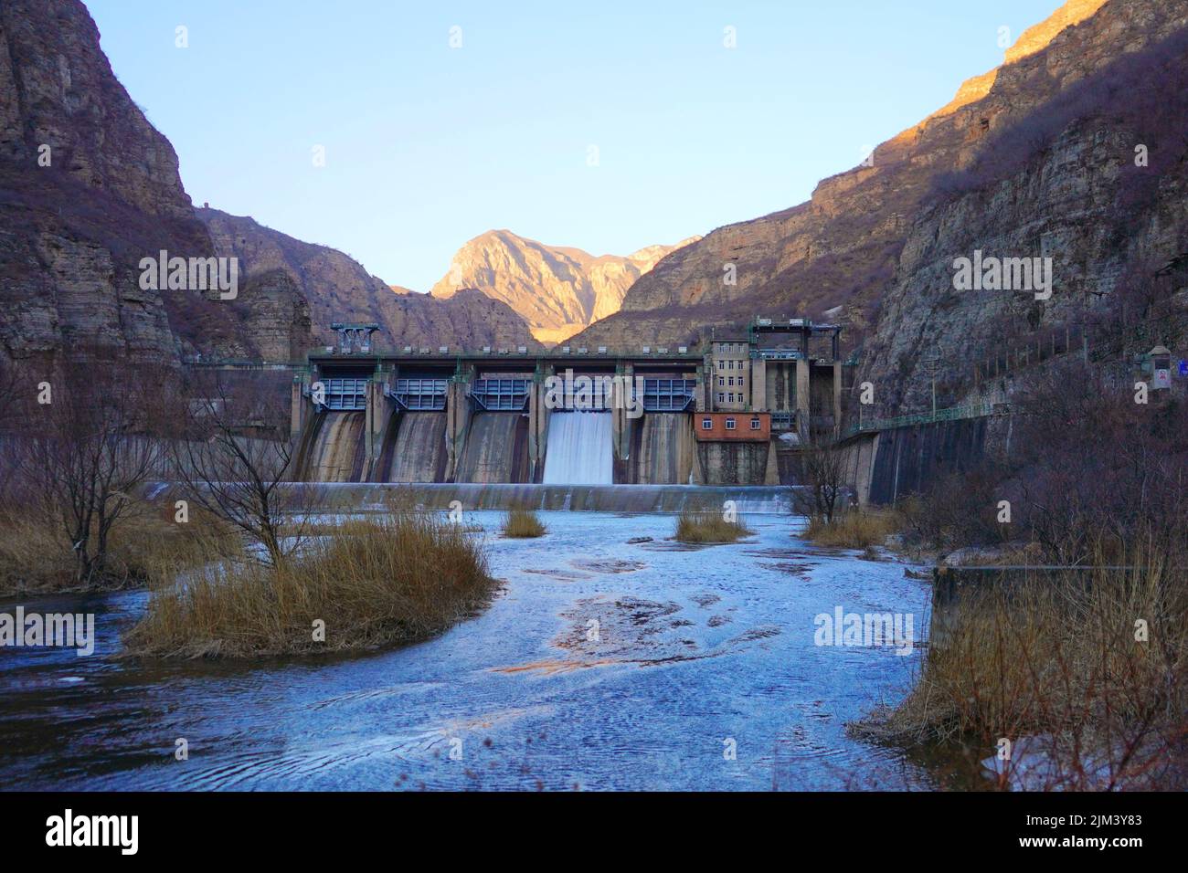 A beautiful Beijing reservoir dam surrounded with mountains in China ...
