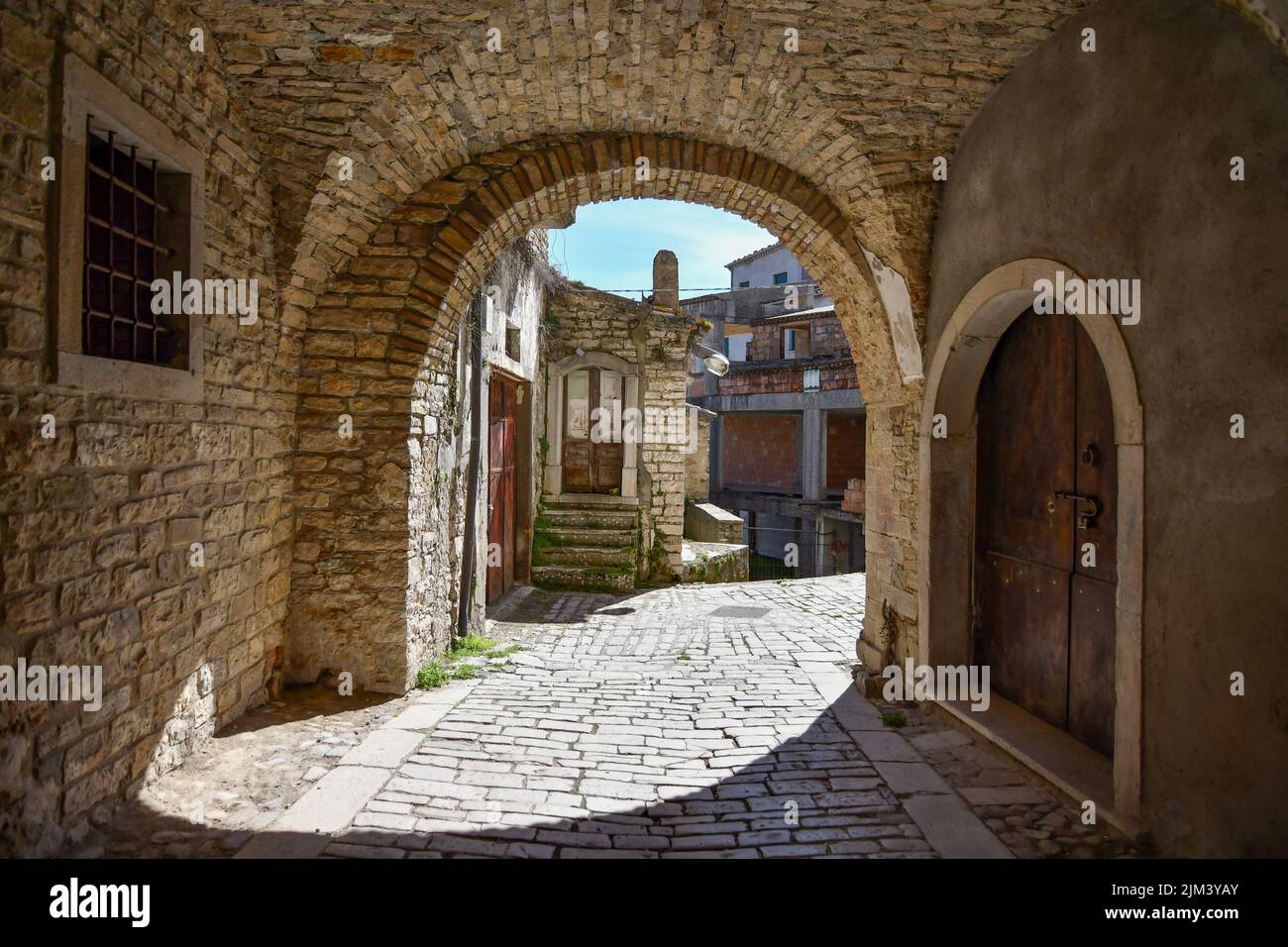 A narrow pathway under an arch in Bisaccia, Italy Stock Photo - Alamy