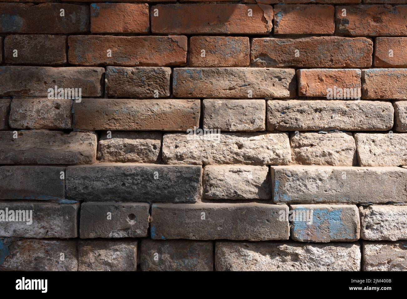 A texture of a brick wall with damaged pieces Stock Photo - Alamy