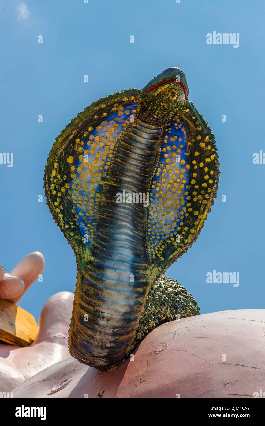 A vertical shot of the snake on the statue of Ganesha in Ganesha Park ...
