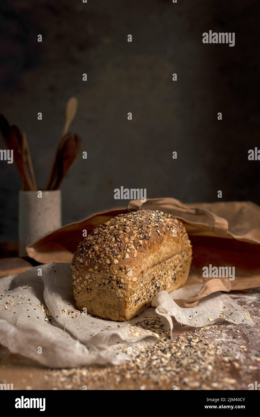 A vertical closeup of homemade sourdough bread with seeds Stock Photo ...