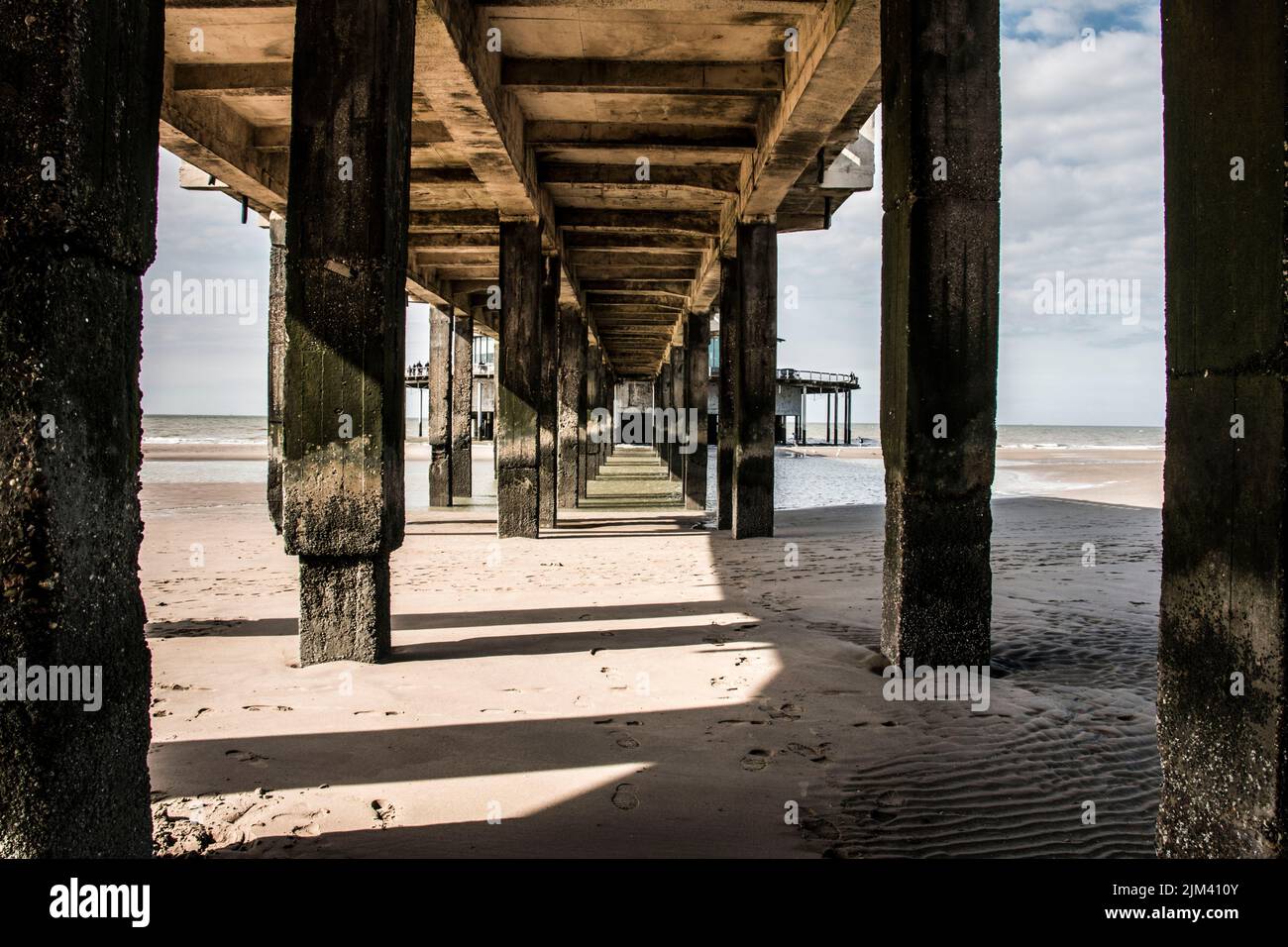 The bottom of a wooden pier at the beach Stock Photo - Alamy