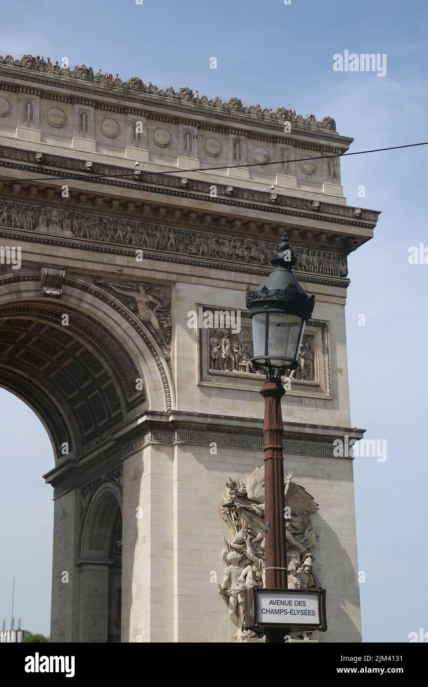 The Triumphal Arch with the engravings and a light pole in Paris ...
