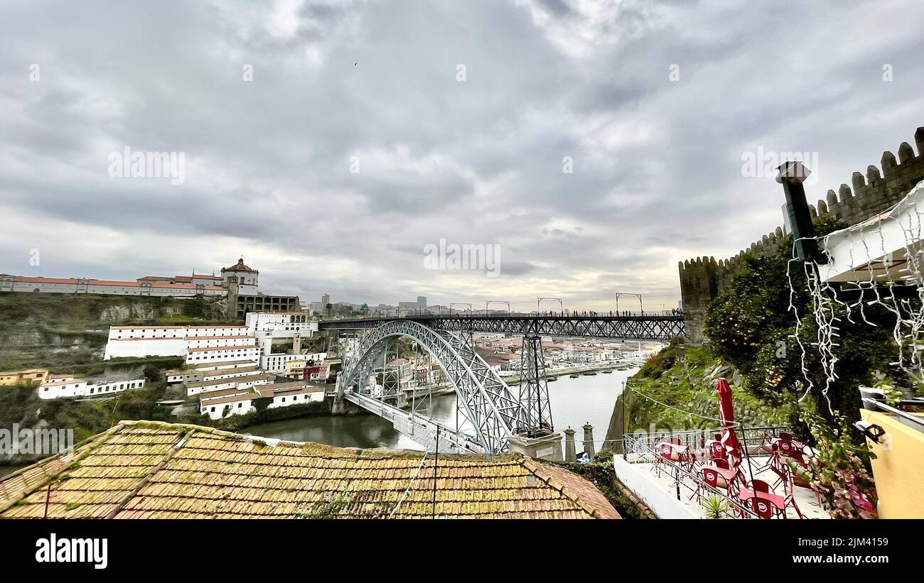 A mesmerizing view of the Ponte Dom Luis bridge over the Douro River on ...