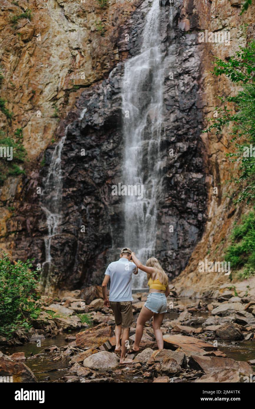 Woman walking tropical forest waterfall hi-res stock photography and ...