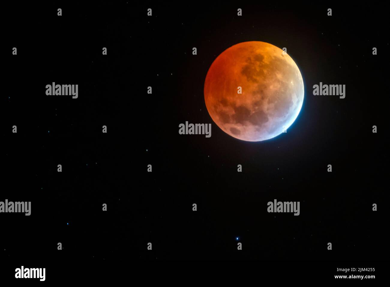 A mesmerizing view of a moon in the dark black sky at night Stock Photo ...