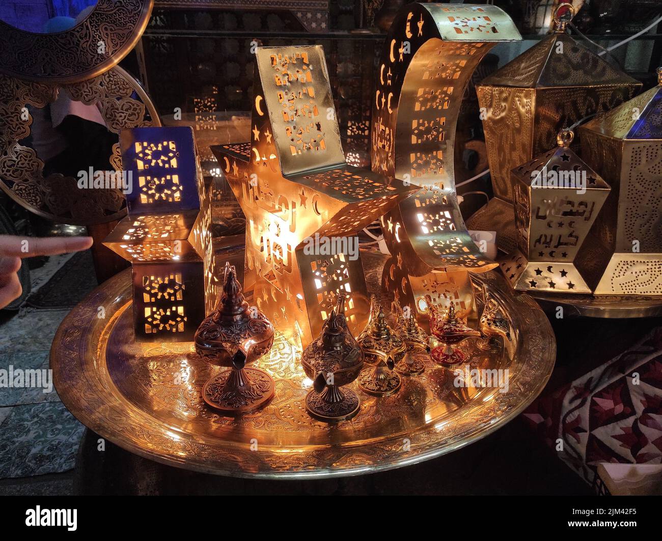 A view of golden stars and moon near Aladdin lamps in Khan el-Khalili ...