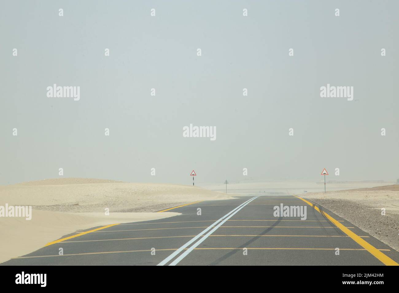 sand covering road blowing acr Stock Photo - Alamy