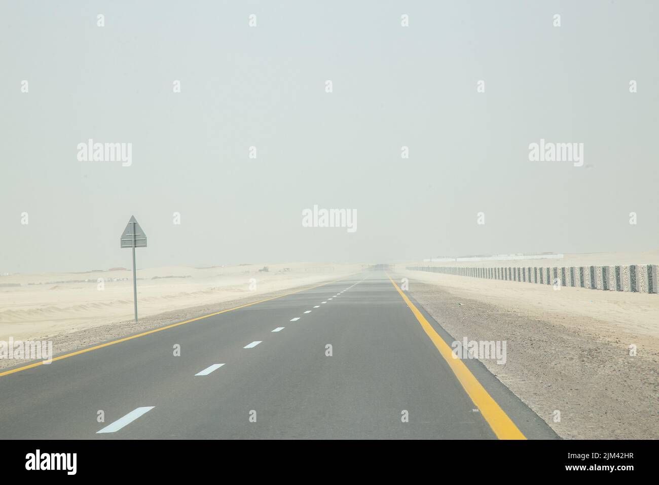 sand covering road blowing acr Stock Photo - Alamy