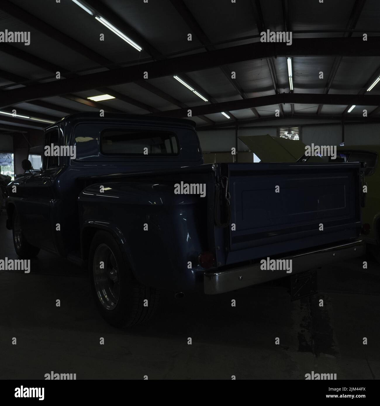 A vertical shot of American pickup parked in garage Stock Photo - Alamy