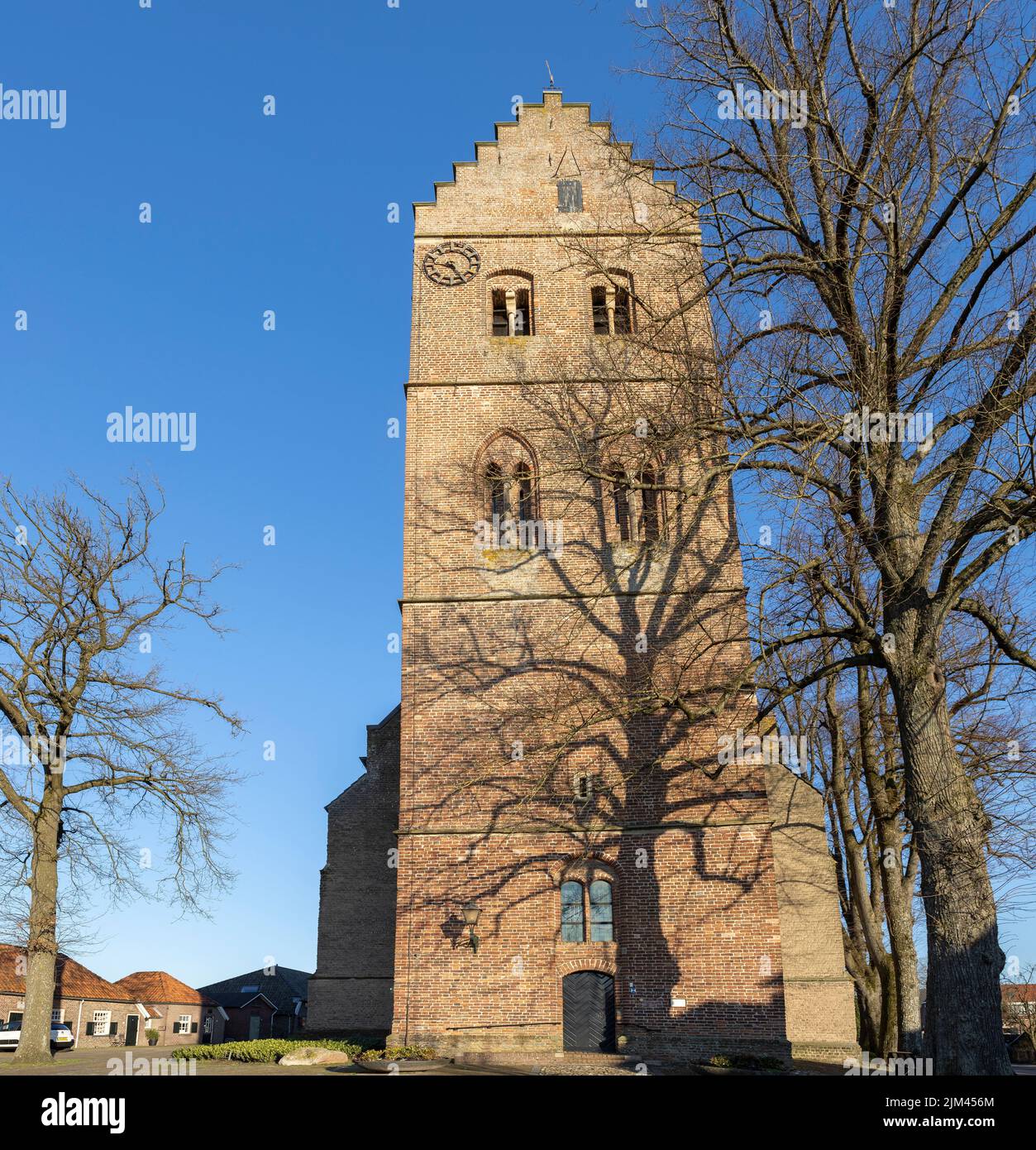 Tall church tower of Christophorus kerk in Geesteren town seen from ...