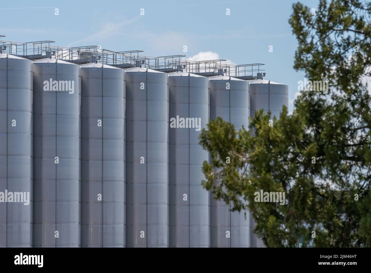 A beautiful shot of an Industrial zone with aluminum silo structures in ...