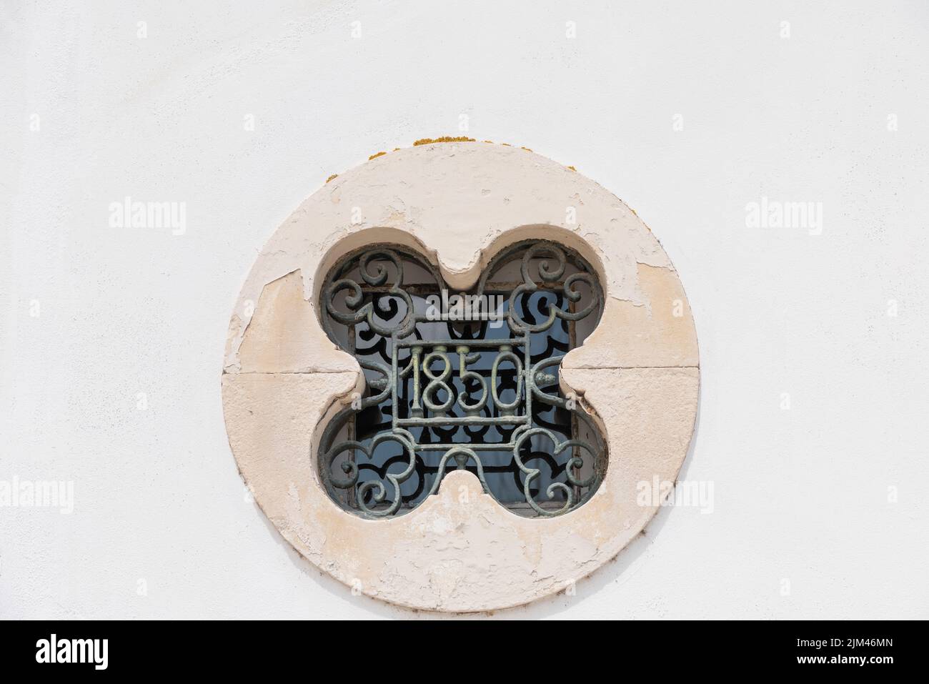 A closeup of an ancient window grid on a wall built in 1850 Stock Photo ...