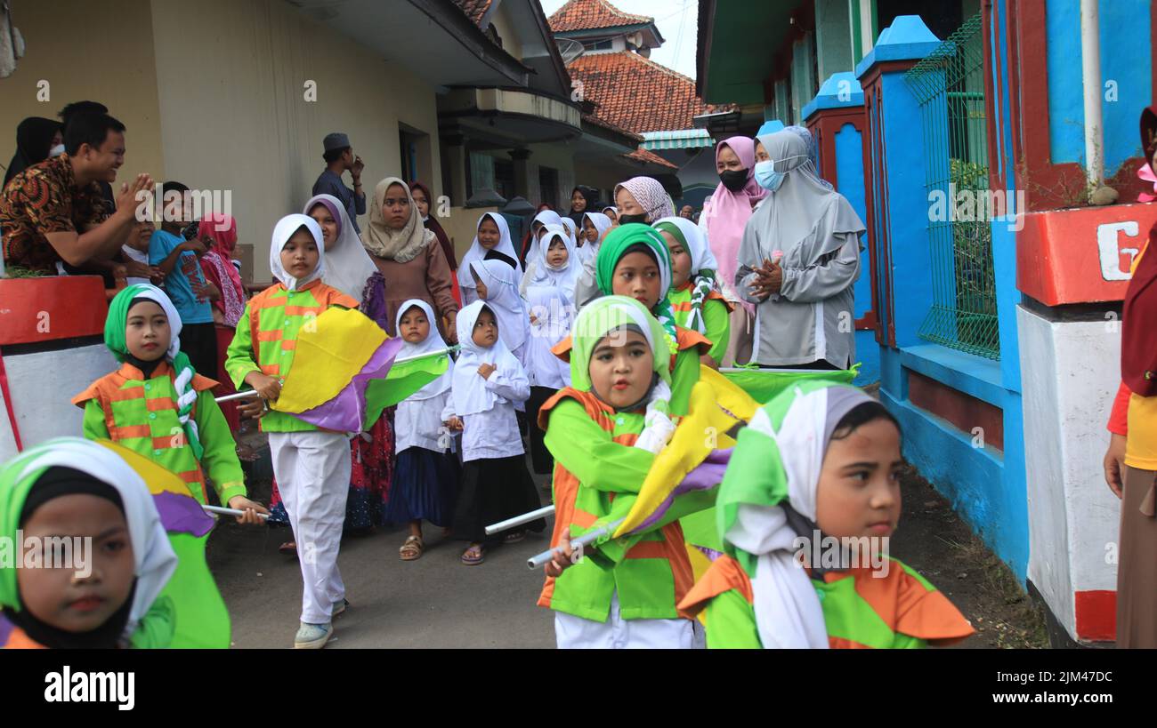 A children's marching band getting ready to perform in the streets of ...