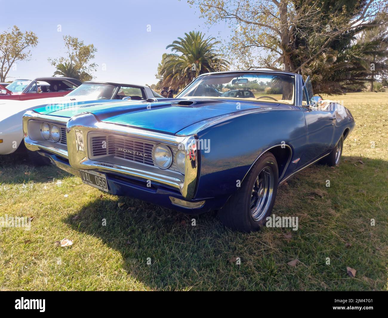 Old blue sport Pontiac GTO two door convertible 1969 in the countryside ...