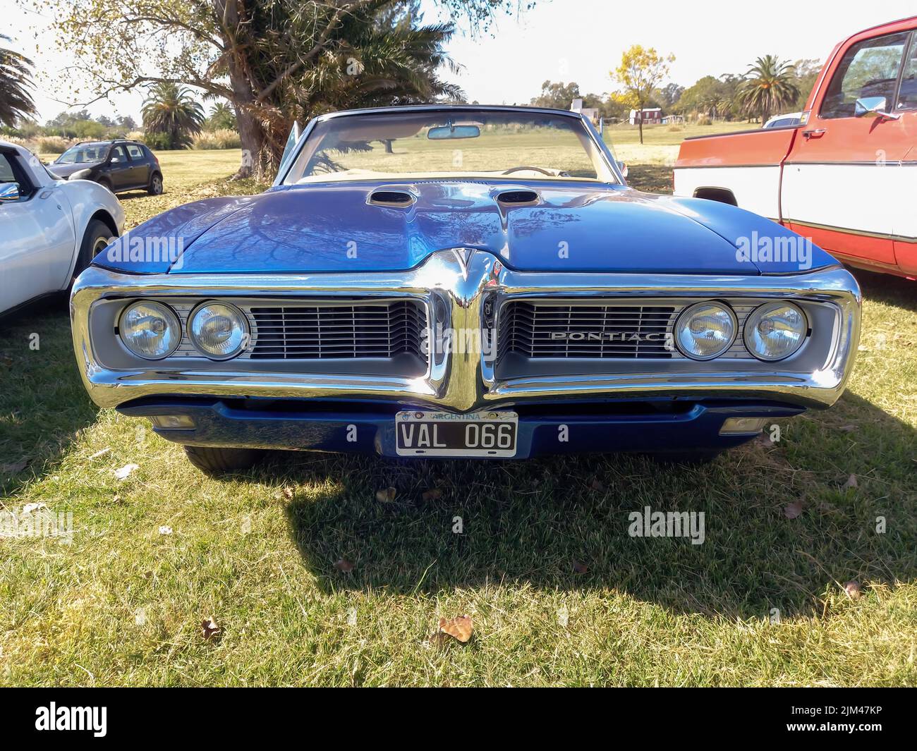 Old blue sport Pontiac GTO two door convertible 1969 in the countryside ...
