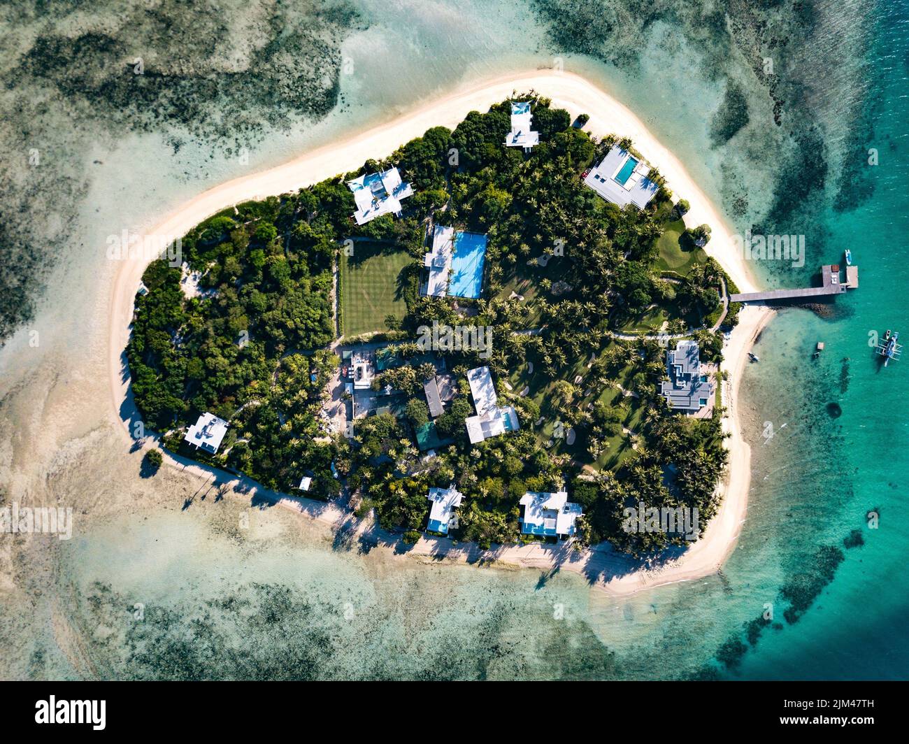 A bird's eye view of a tropical island in greenery Stock Photo - Alamy