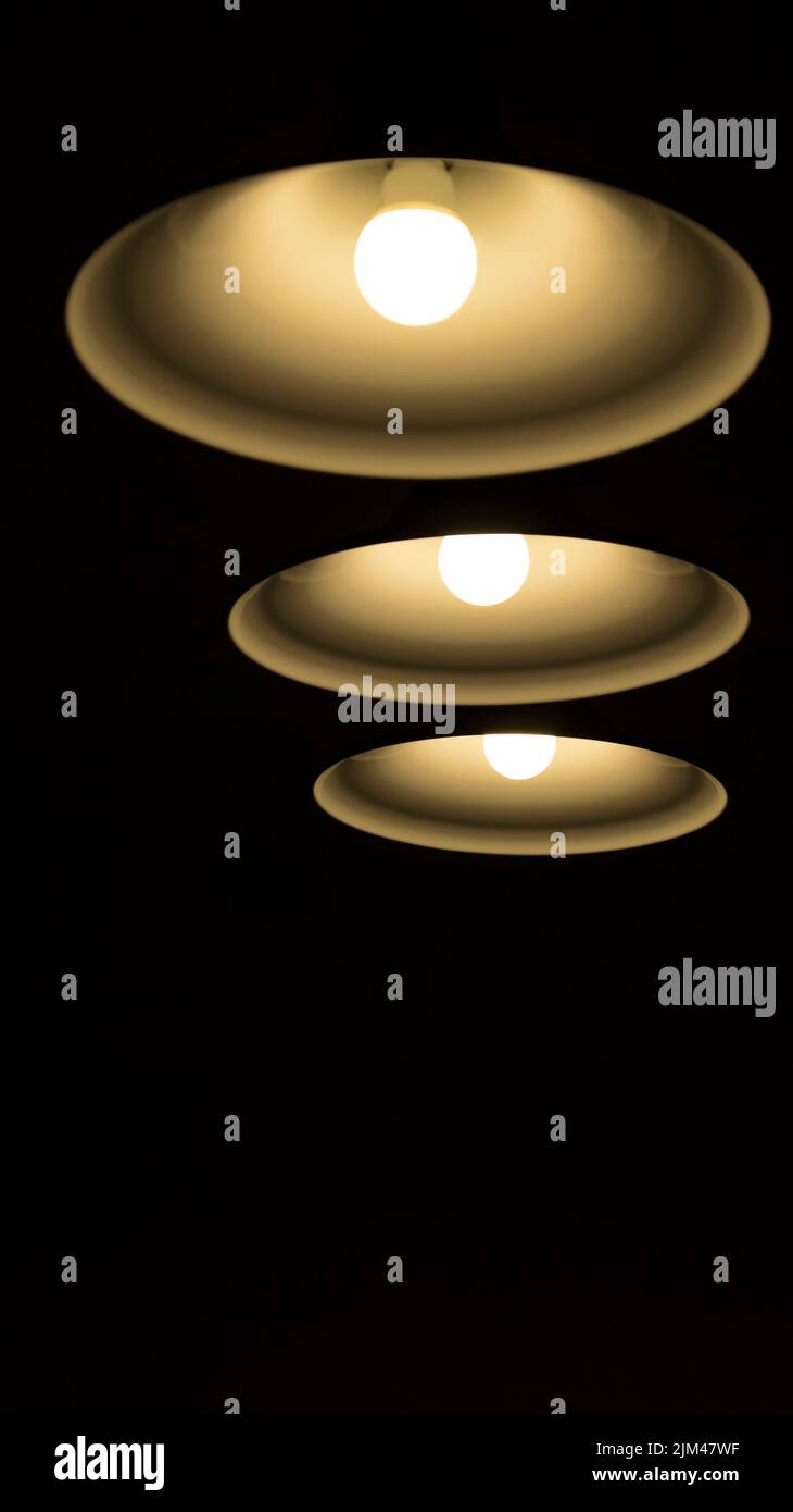 A vertical shot of beautiful lamps on the black background Stock Photo ...