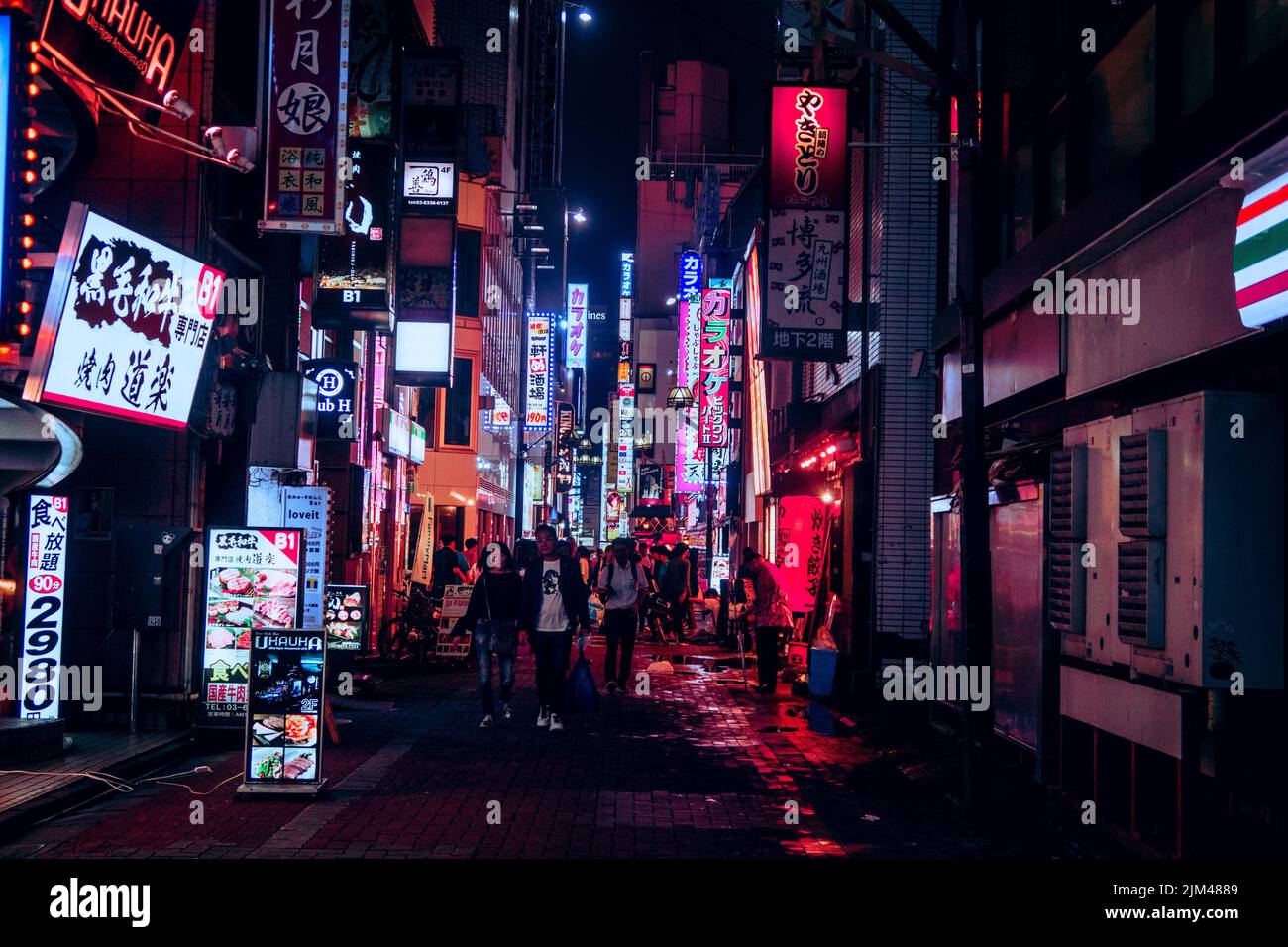 A night view of the city with people walking Stock Photo - Alamy
