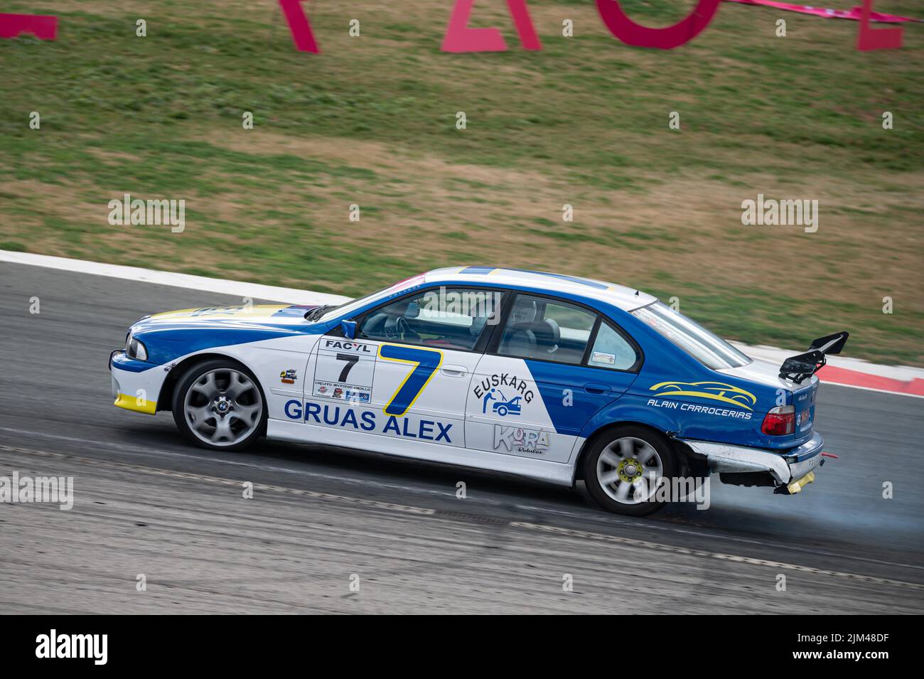 Blue and white BMW E39 drifting on the racing circuit Stock Photo - Alamy
