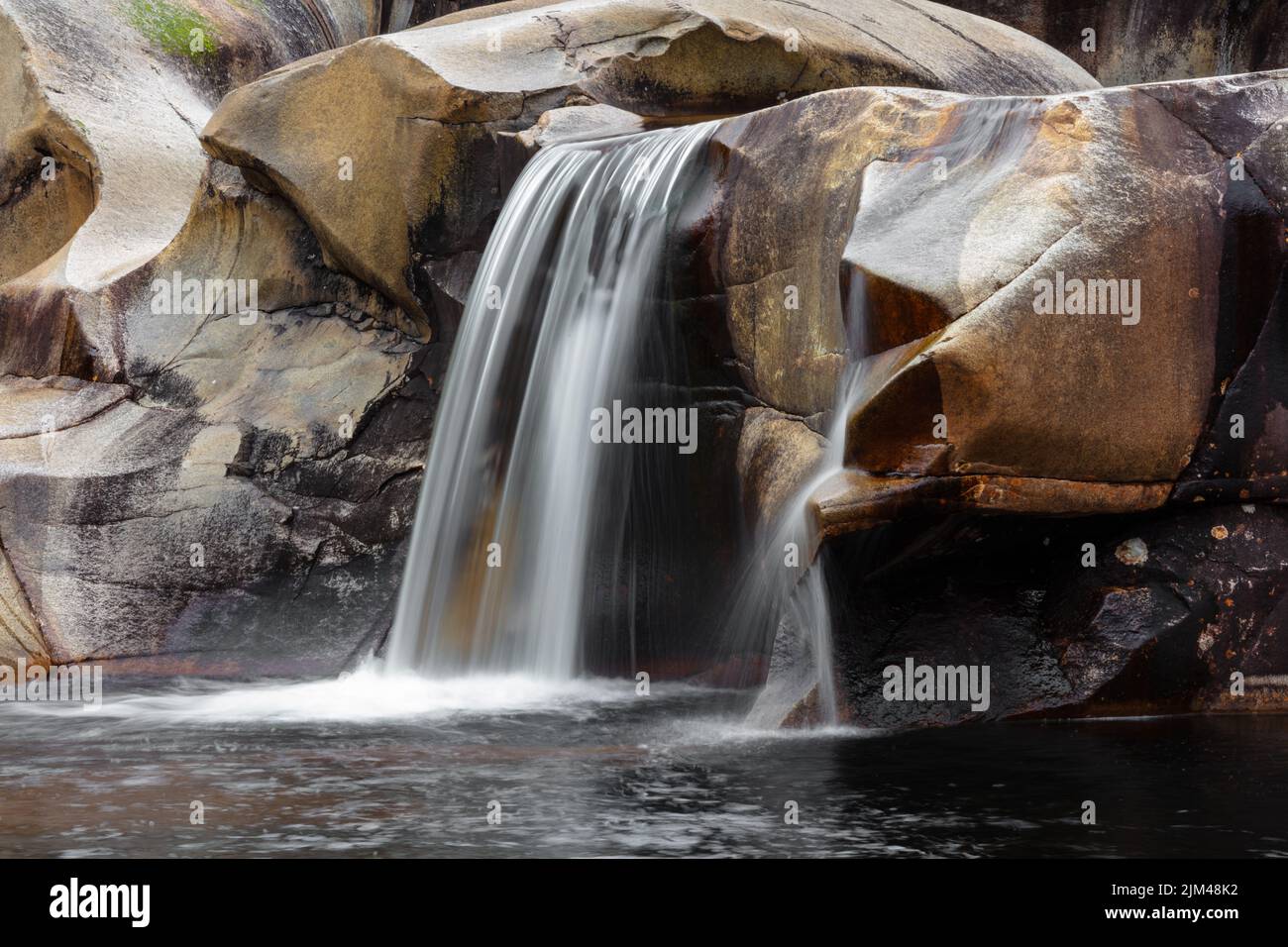 A waterfall on rocks formed in last ice-age in Jettegrytene, Norway ...