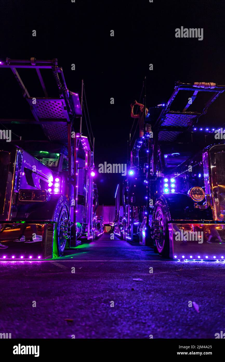 A vertical shot of the 75 Chrome Shop Truck Show 2022 at night Stock ...